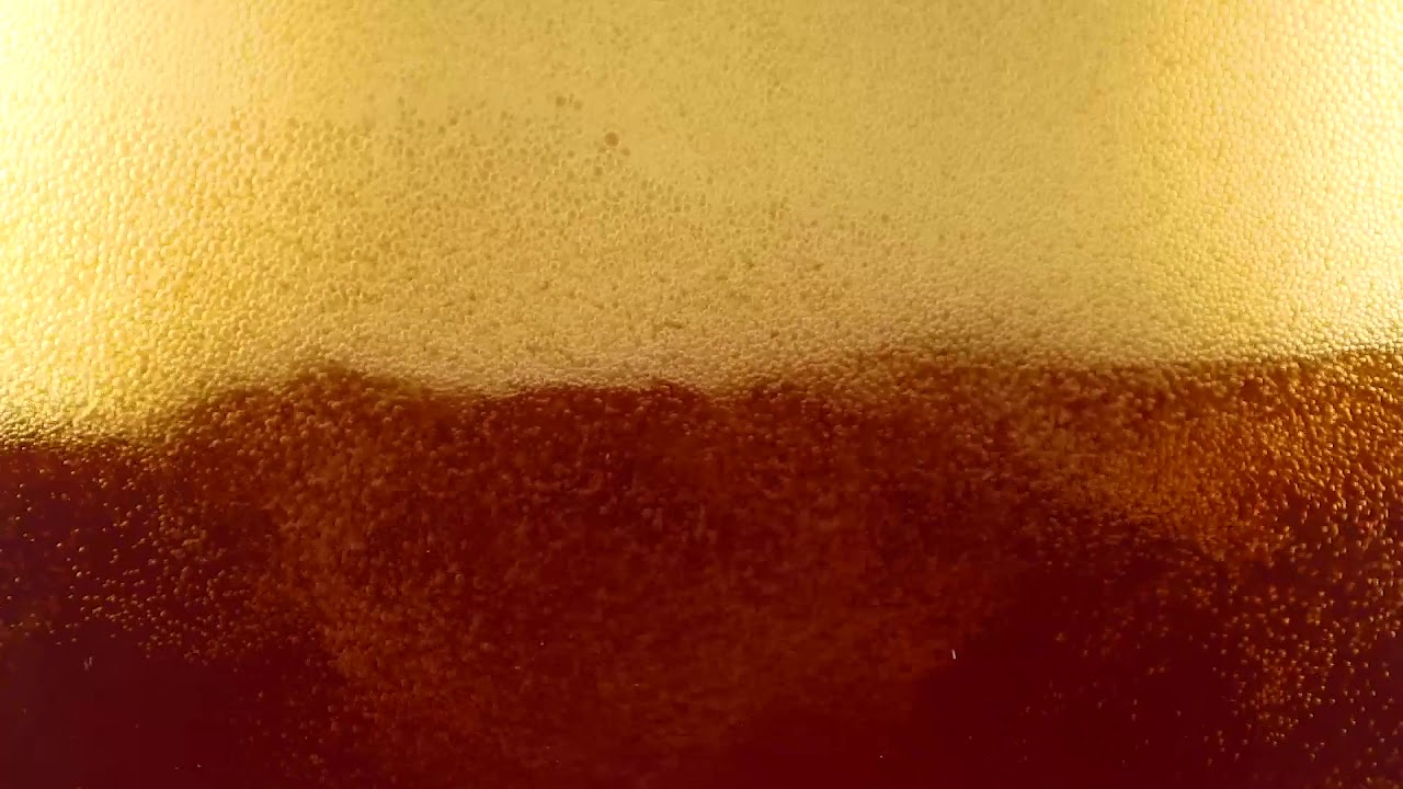 mixkit beer foam forming in a glass seen from close up 8708 - YouTube