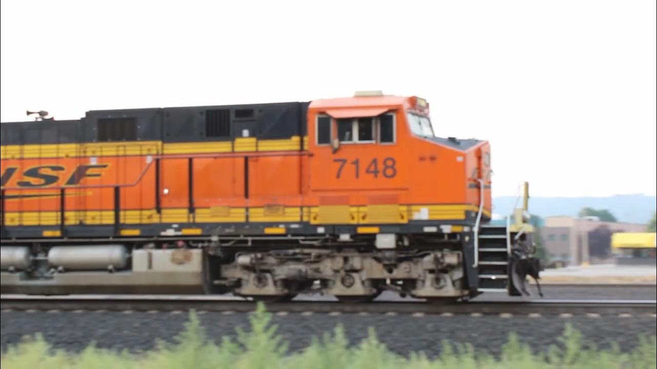 BNSF Engine 7148 East bound then heads west backwards and engine 5047 West bound again then ...