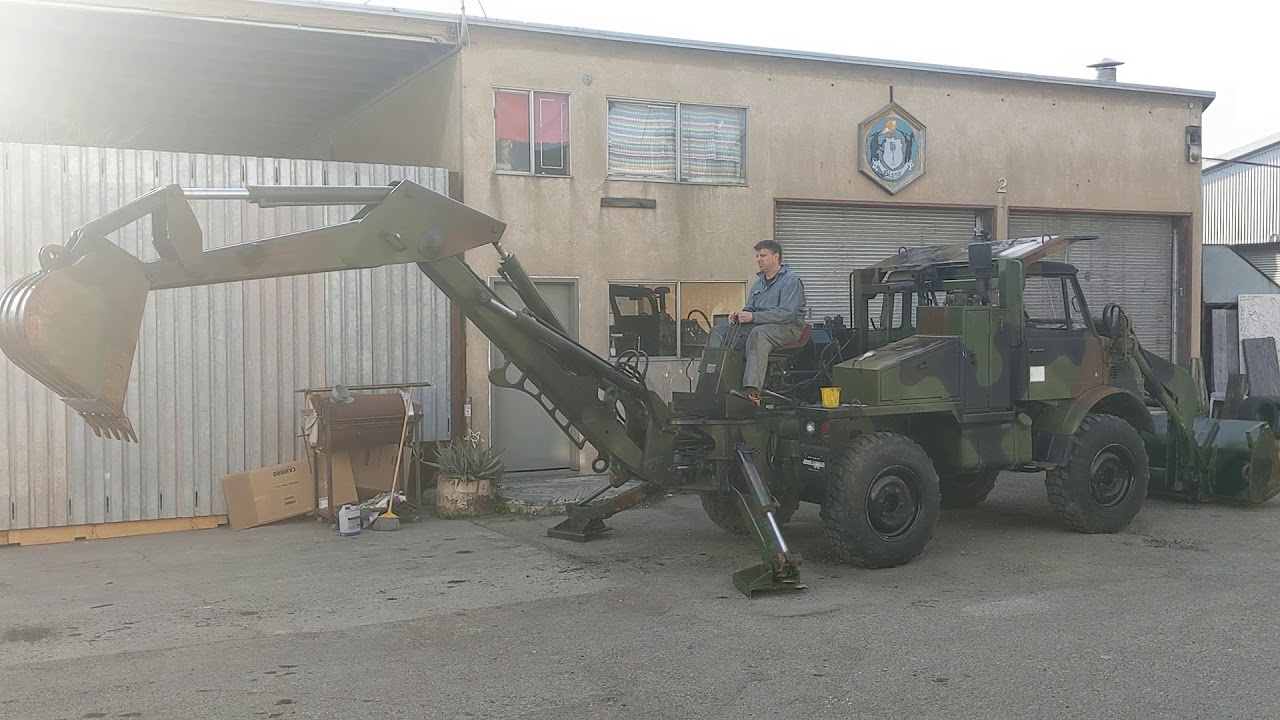 Unimog backhoe test - YouTube