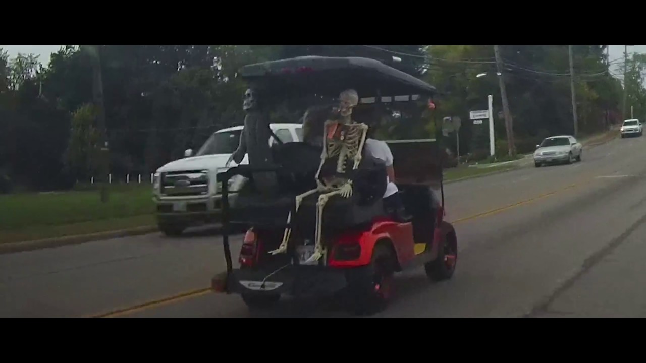Driving a Golf Cart with a skeleton on US 6 - Vermillion, Ohio - YouTube
