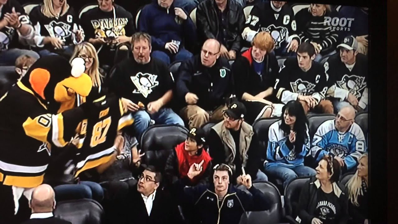 Young Penguins fan gets puck and jersey after older fan stole puck ...