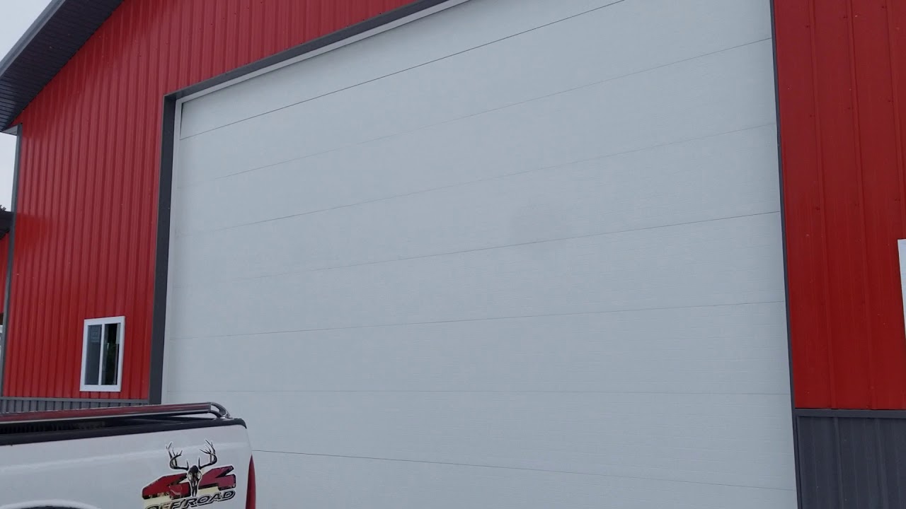 Haas 2016 door with Manaras dual trolley operator - YouTube