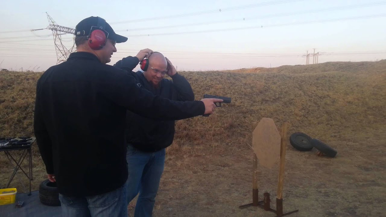Holding a Glock while shooting - YouTube