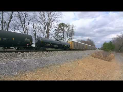 NS 4228 leads a long southbound manifest across the state line at ..NS 4531 & 4287 as mid DPU'S ...