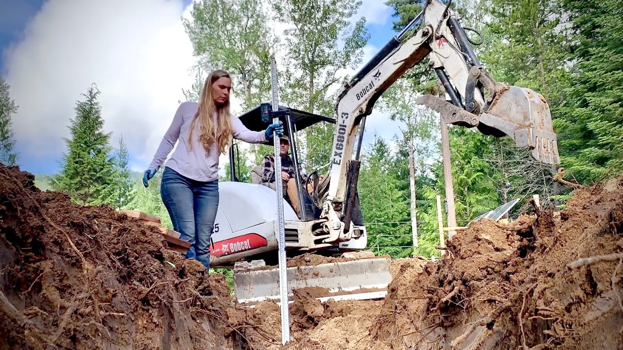 Couple Builds Off Grid Dream Home - Digging Footers for the Garage ...