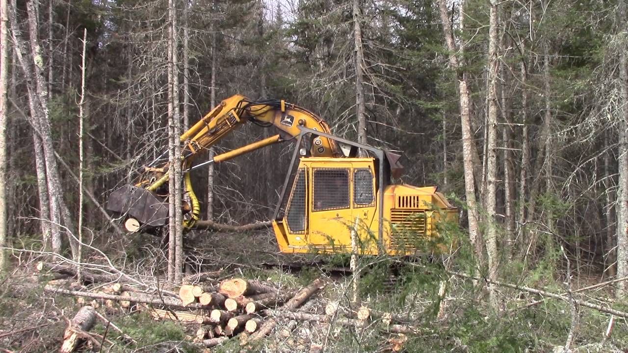1994 John Deere 290D Processor with a Fabtek 2 Roller Head - YouTube