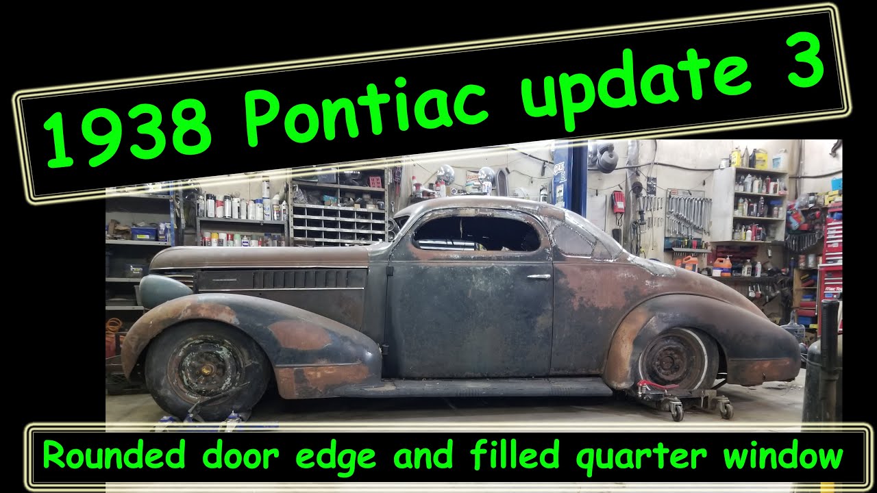 1938 Pontiac rounding the door edge and filling the rear quarter window ...