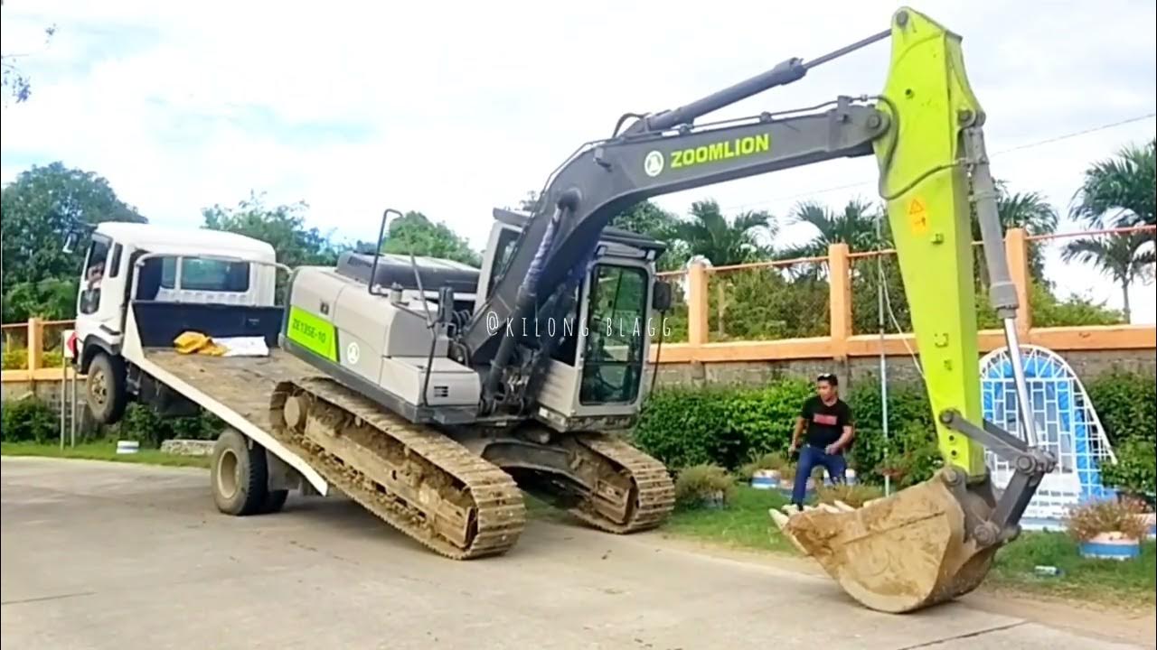 Backhoe Manual Unloading - YouTube