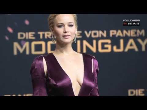 Jennifer Lawrence shows off her cleavage in a plunging purple gown!
