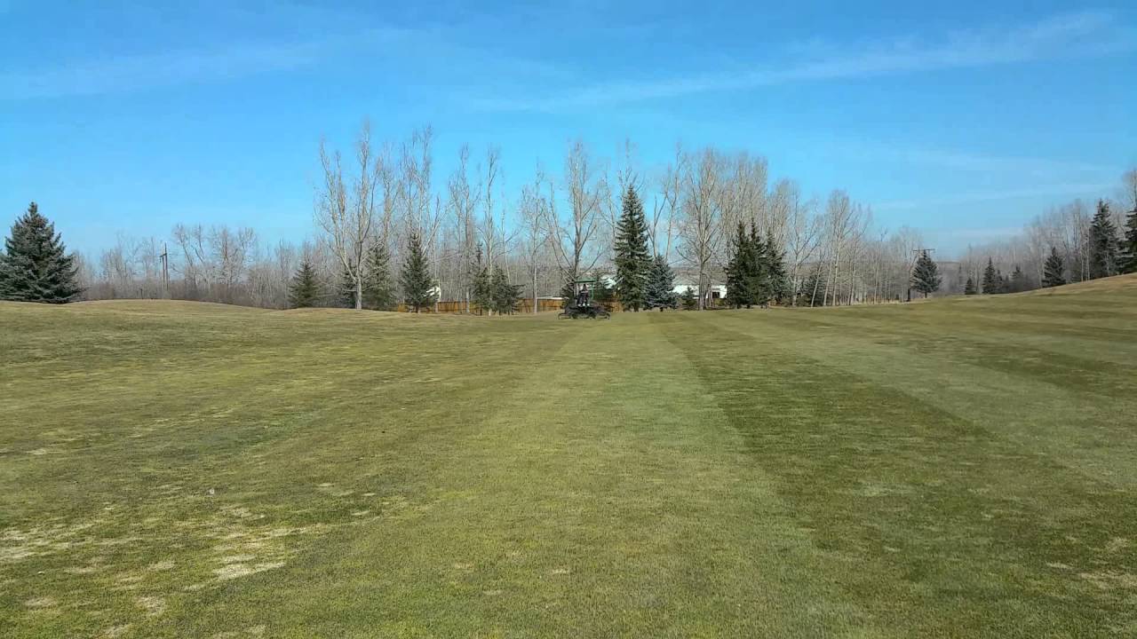 Verticutting fairways - YouTube