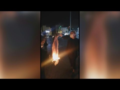 Woman burns headscarf amid Iran protest crackdown | AFP