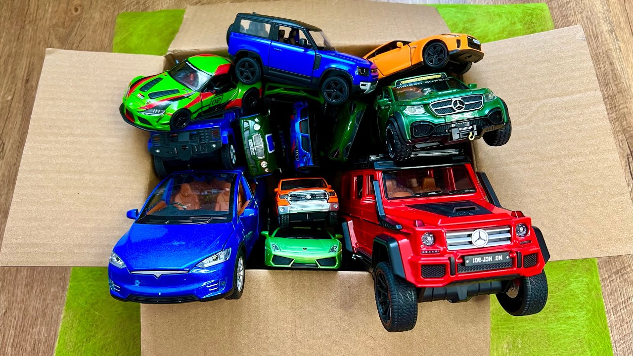 Box full of various miniature cars Peugeot, Volvo, Renault, Hyundai ...