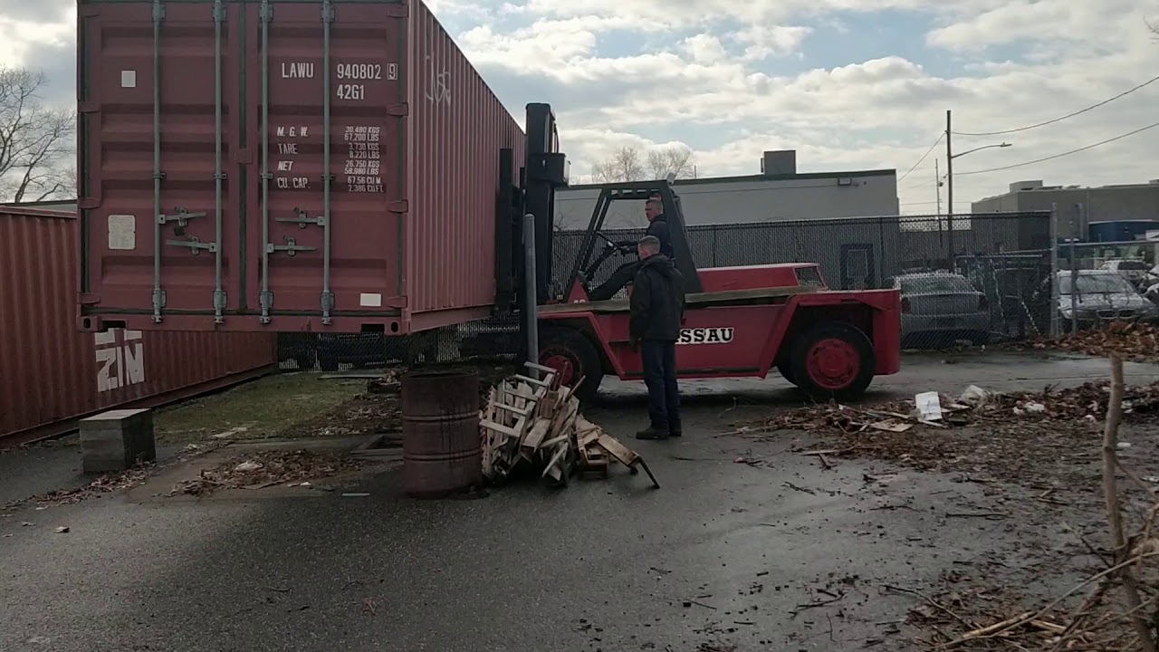 Moving a 40 foot shipping container - YouTube