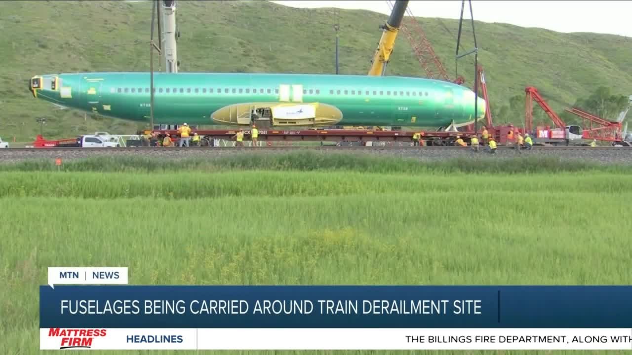 Boeing fuselages moved past derailment site - YouTube