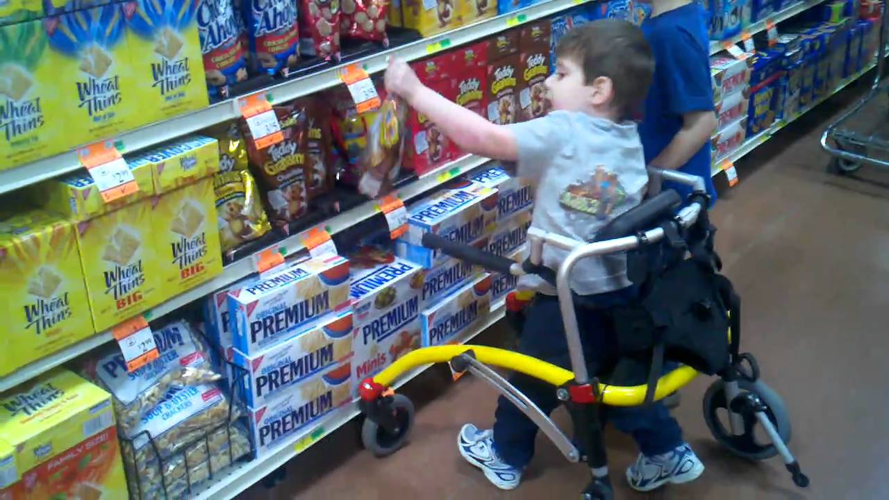 Brandon at the grocery store in his Crocodile Walker - YouTube