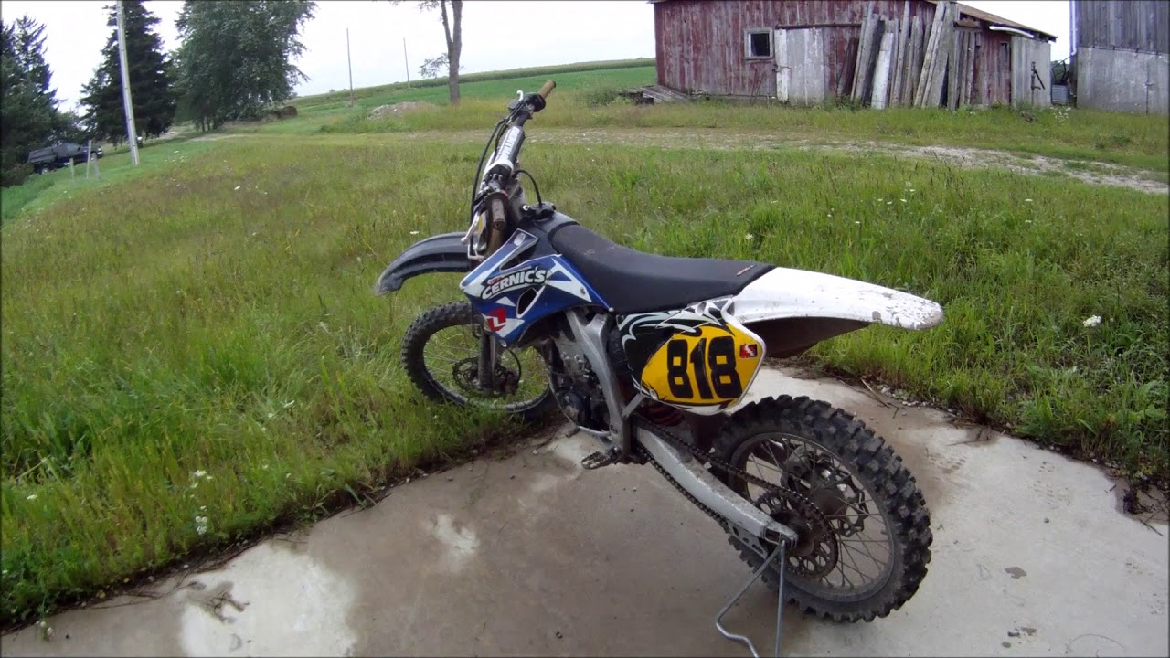 2009 yz250f review and wheelies - YouTube
