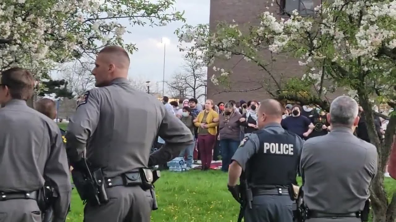 UB protesters lock arms - YouTube