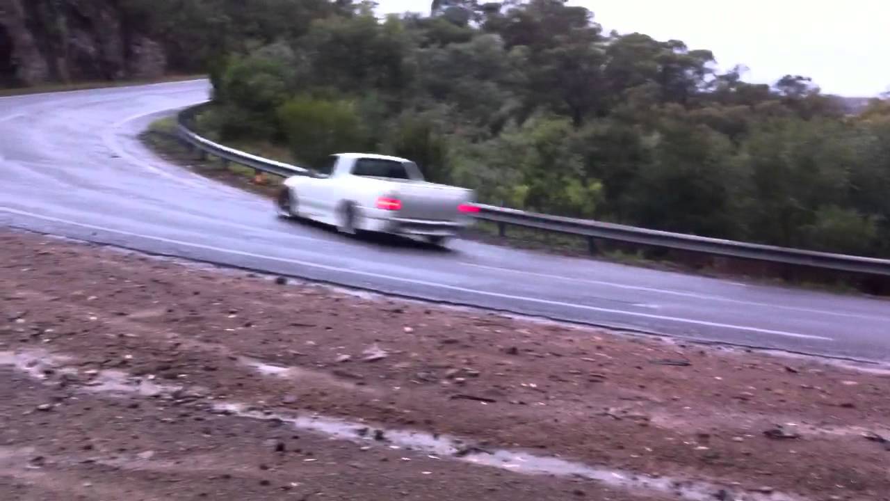 Holden Commodore Vu V6 Ute Drift in the Rain - YouTube