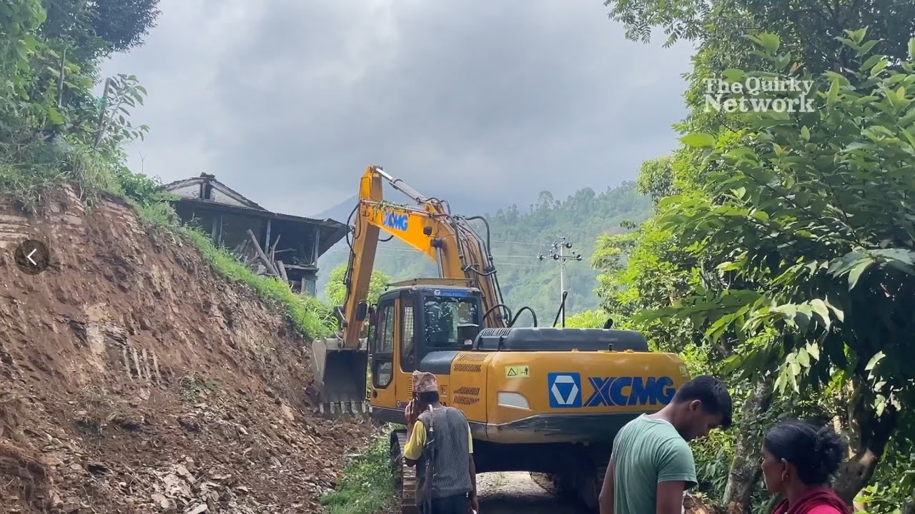 Mountain Road Expansion: Dedicated Excavator Operator at Work ...