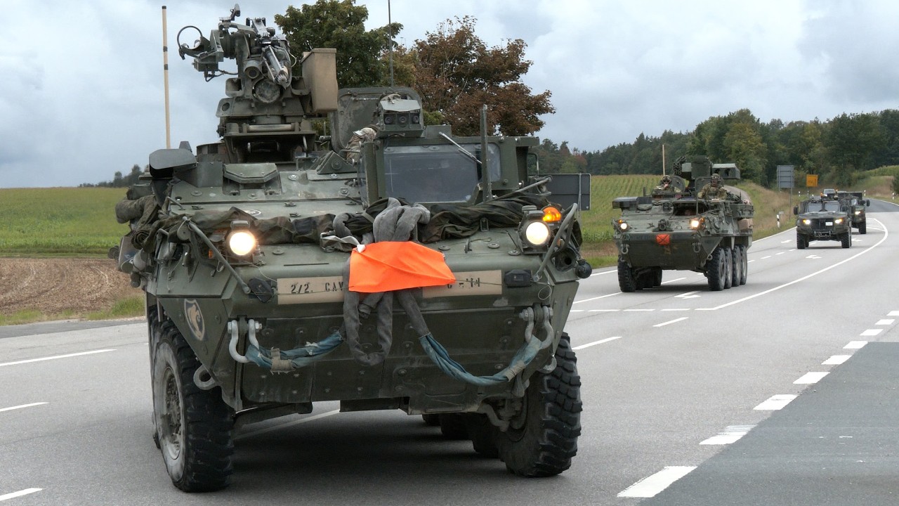 Over a hundred US Army trucks and military police travel in convoys ...