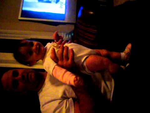 Baby kicks dad in the balls!