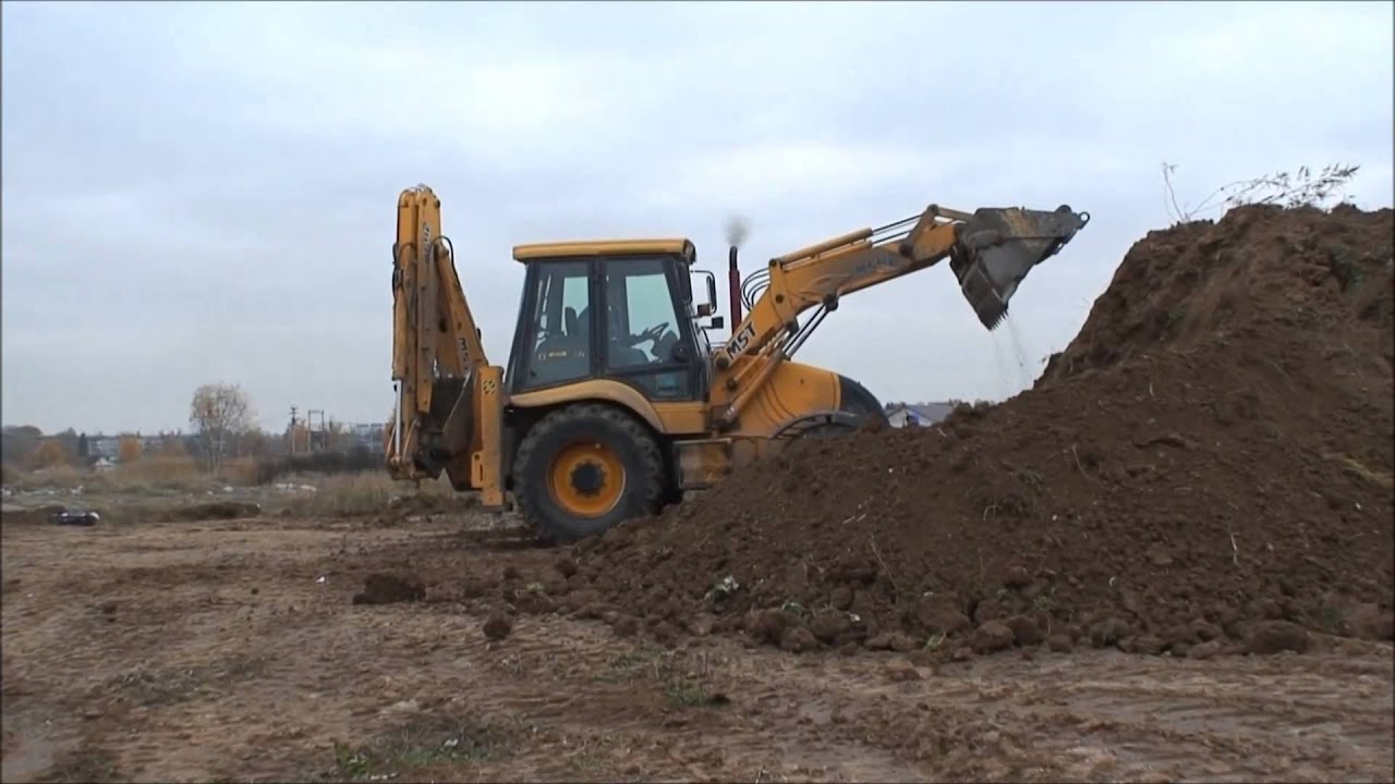 MST M542 backhoe loader Loader truck loading test - YouTube