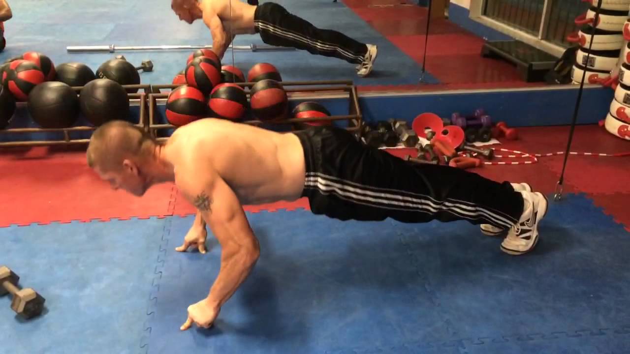 Neutral Corner Gyms owner/boxing trainer demonstrates 1 finger push-ups ...