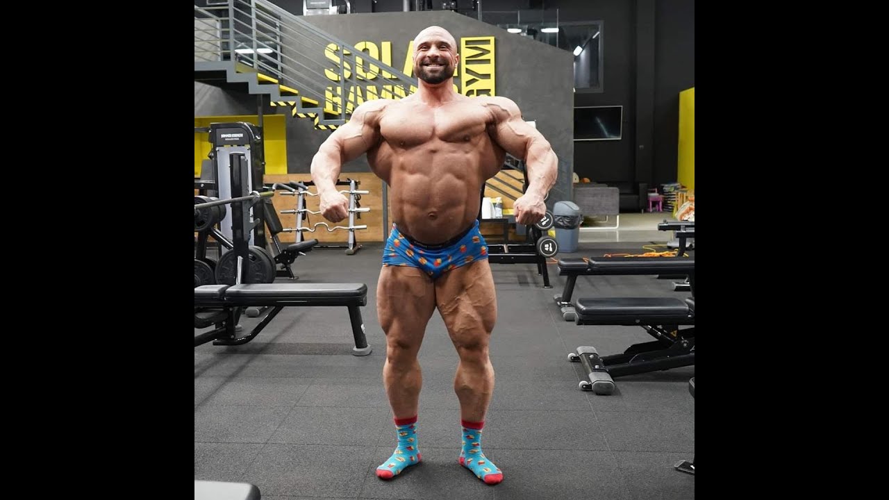 Bald bearded huge muscle god Igor Illes (#Slovakia)´s posing in sweaty ...