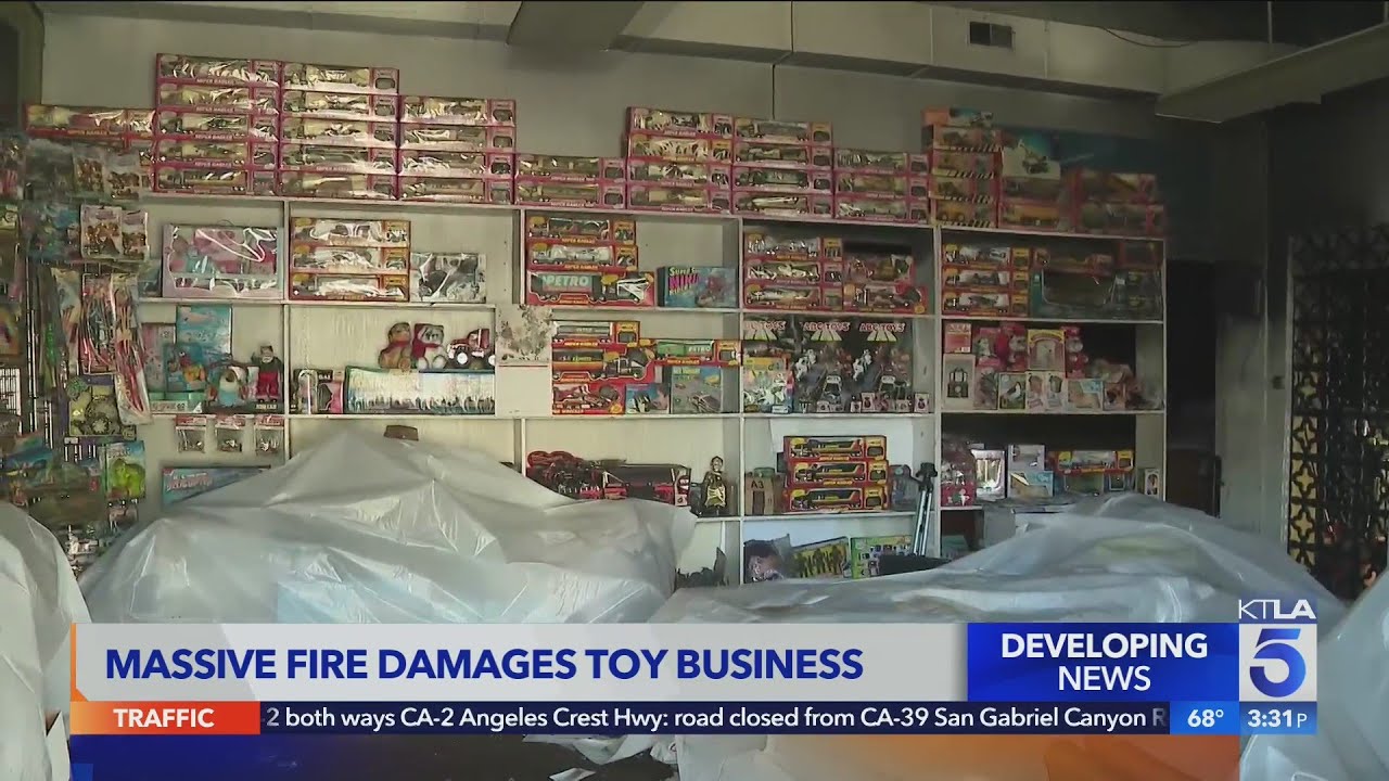 Massive fire damages toy business - YouTube