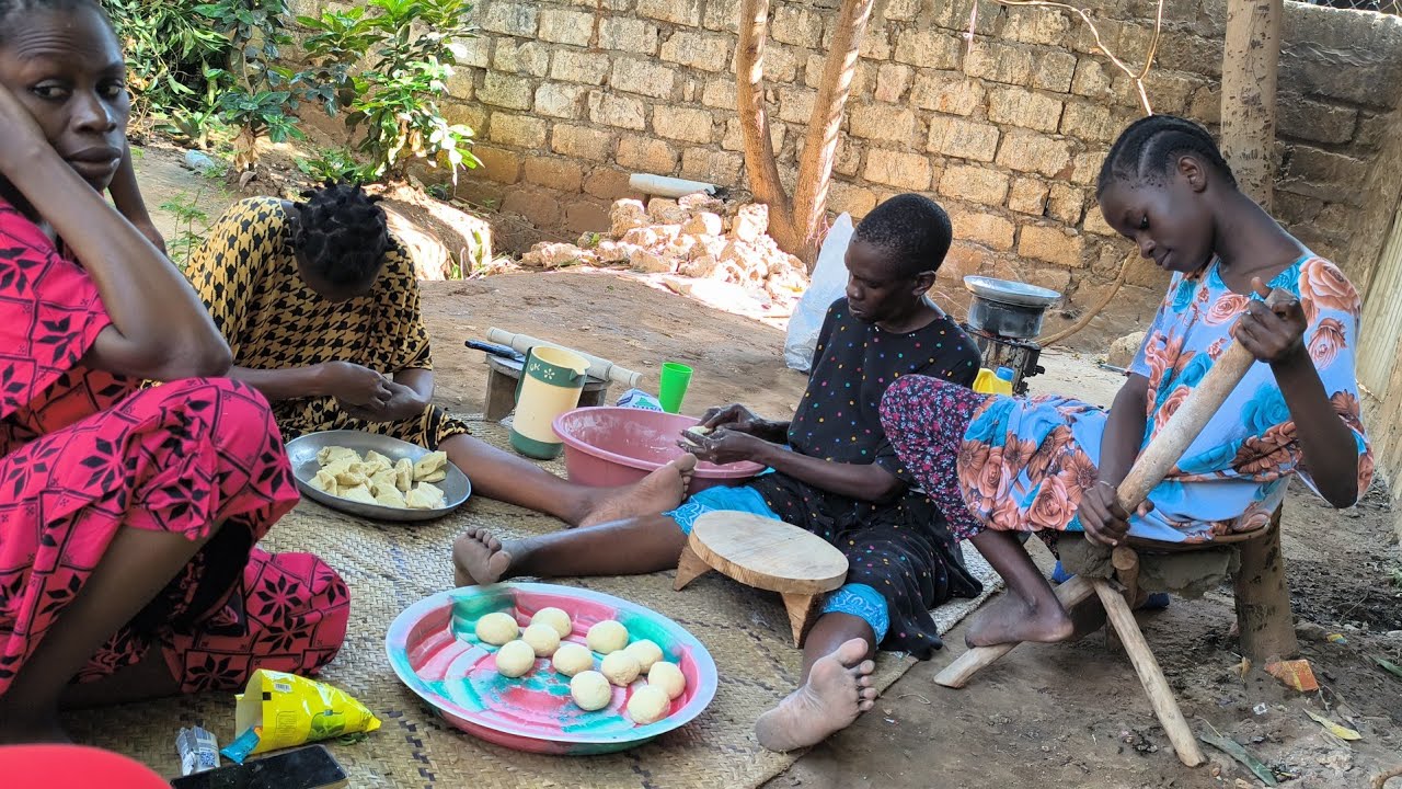 African village life #grandmother #cooking mahamri with beans for ...
