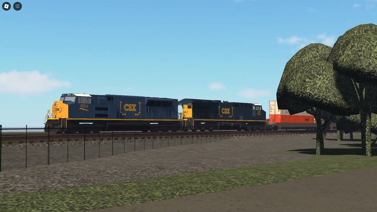 CSX I038 with an SD70ACe-T4 leading passes through a town in South ...