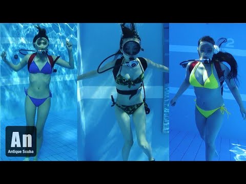 antique scuba angels in pool