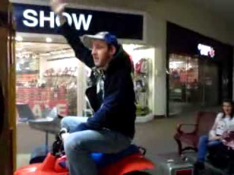 Terry Yates riding his fourwheeler at the mall - YouTube