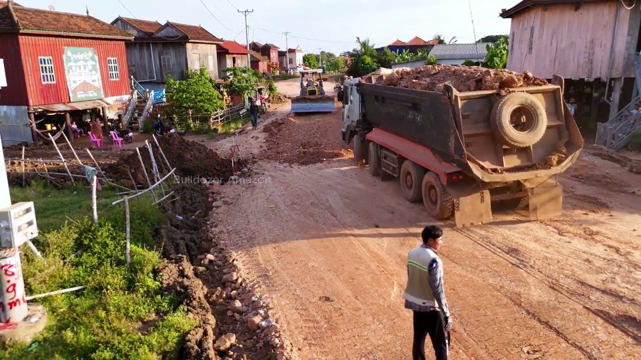 Fantastic Action! Filling up soil in flooded road for building base foundation by skillful dozer ...