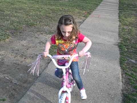 3- 17-2012 Kenzie practicing her balance on a non-training wheeled bike ...