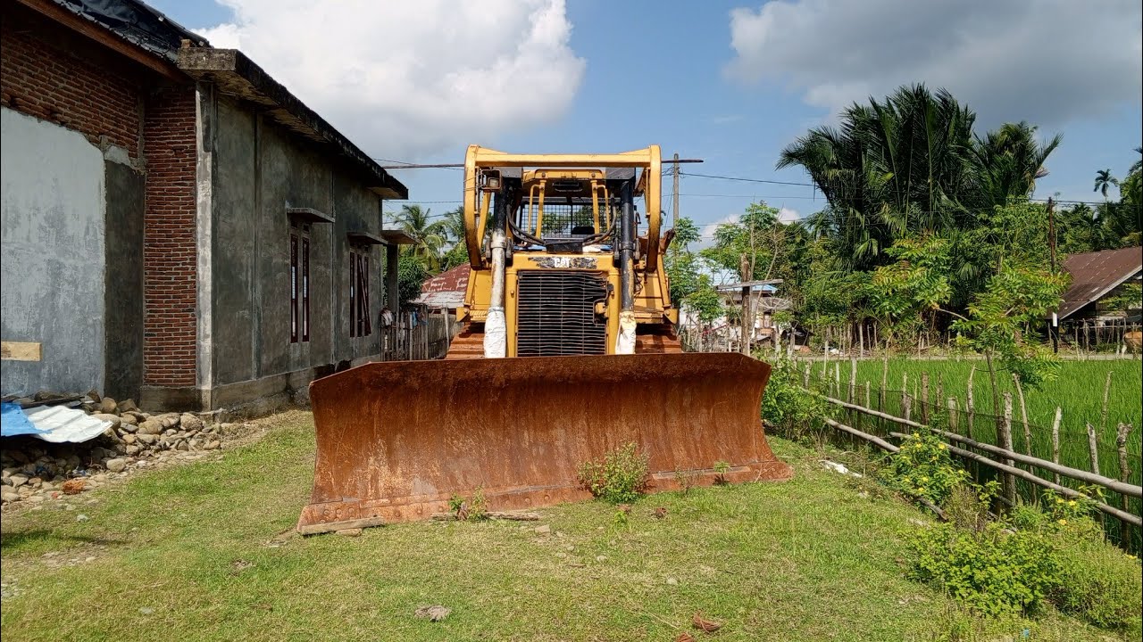 Bulldozer D6r Xl works to create a terrace for oil palm plantations ...