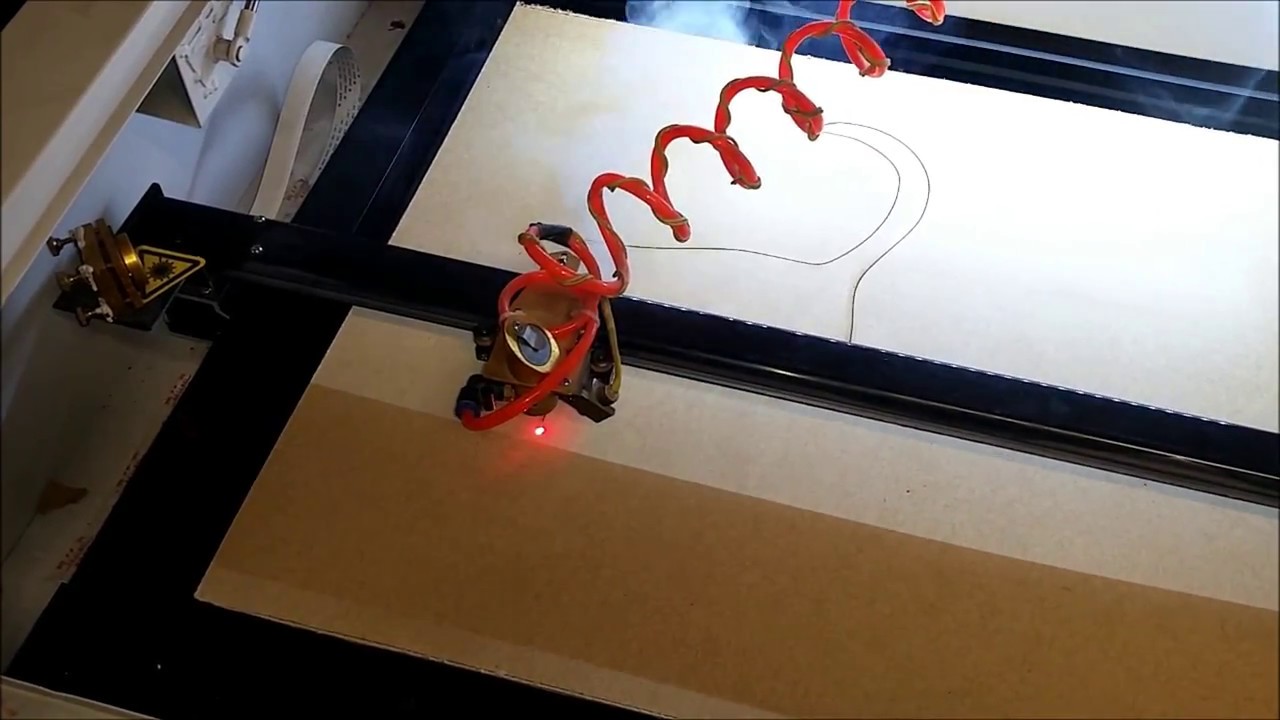 Laser cutting a silhouette cat - YouTube