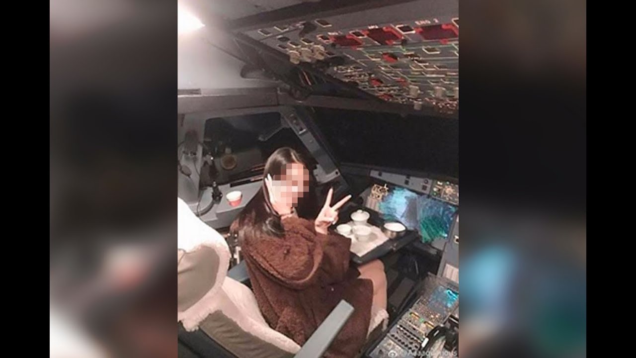 Pilot fired after letting woman pose for cockpit photo during flight ...