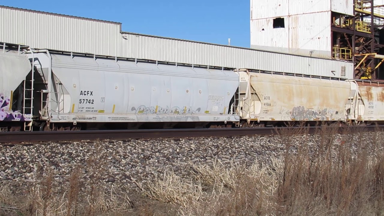 Back and forth view of ACF CENTER FLOW covered hoppers at Harborlite ...