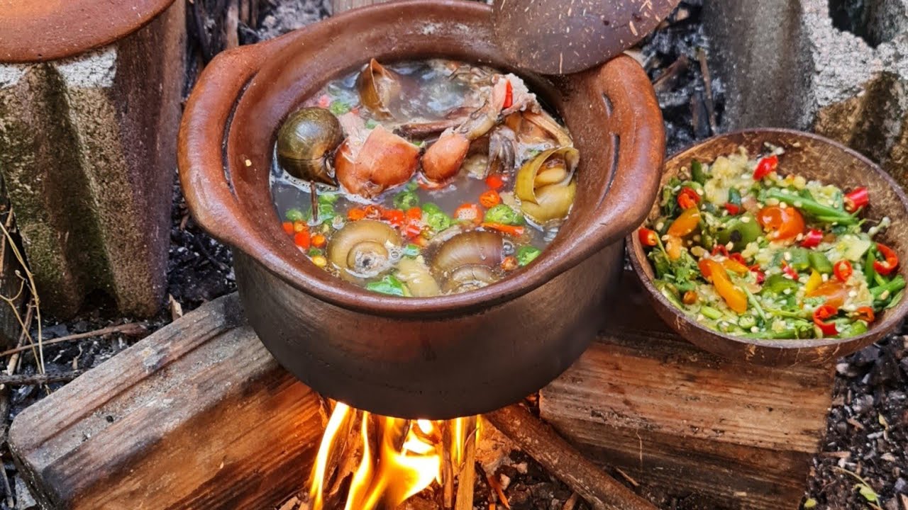 Exotic food. smoked frog w/ rice paddy snail. Highlander indigenous ...