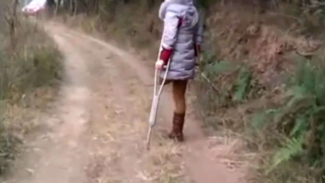 Chinese LAK amputee girl crutching on village path - YouTube