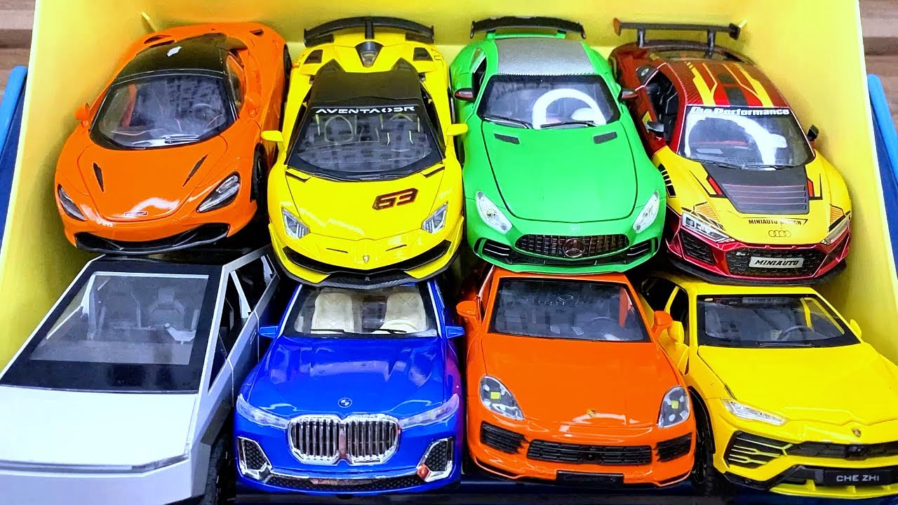 Box full of various miniature cars Peugeot, Jaguar, Pagani, Hyundai ...