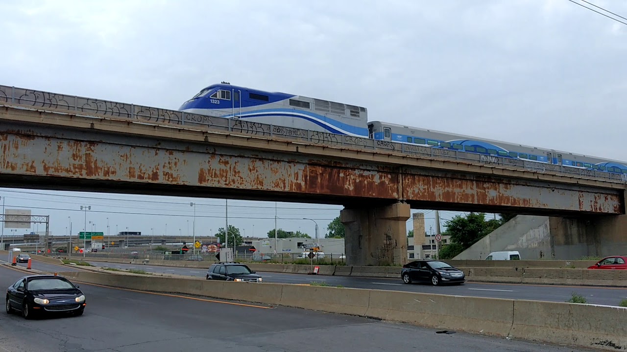 TRAINS AMT Rush Hour Commuter Train over Highway 20 Bridge Montreal ...