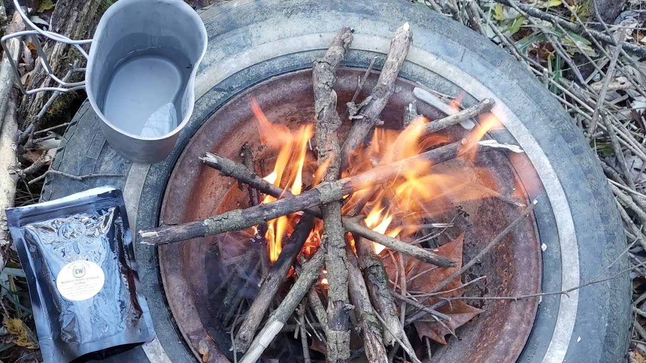 Cooking coffee with a fire in an old tire, and a canteen cup - YouTube