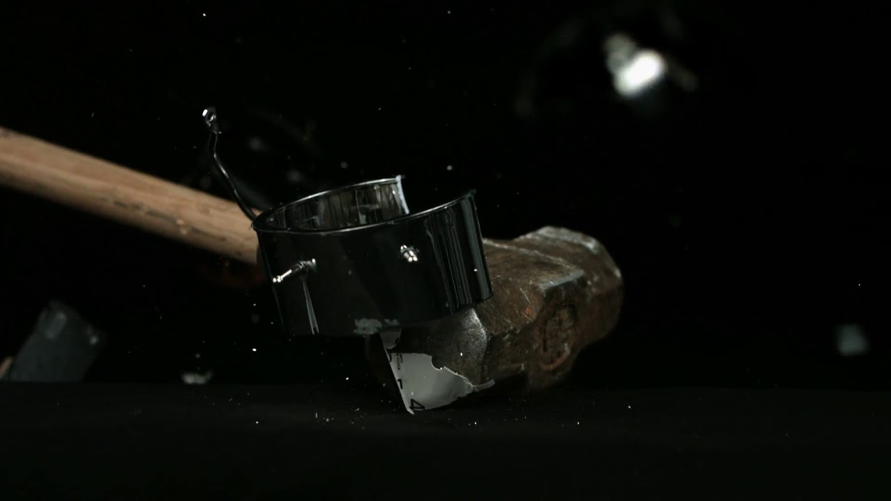 slow motion smashing alarm clock with sledgehammer - YouTube