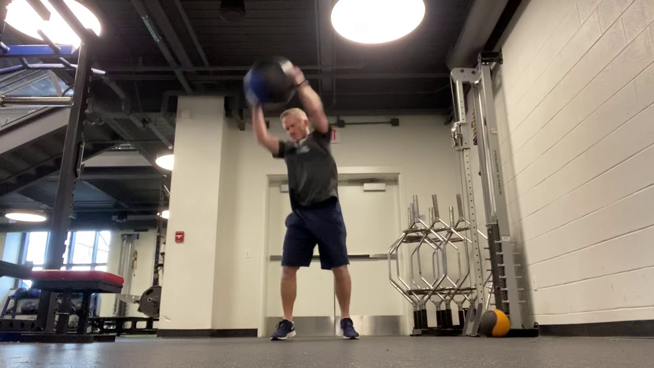 Standing rotational overhead med ball slam - YouTube