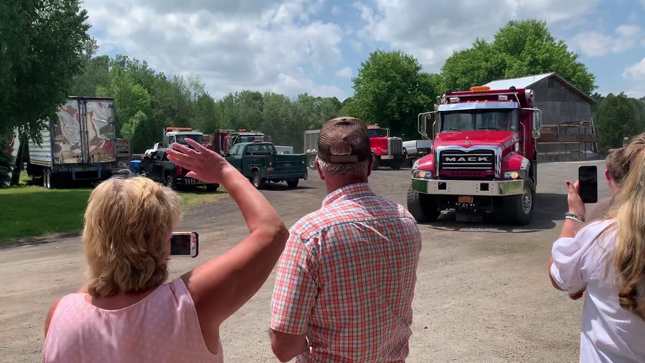 Dump truck parade for retiring highway superintendent - YouTube