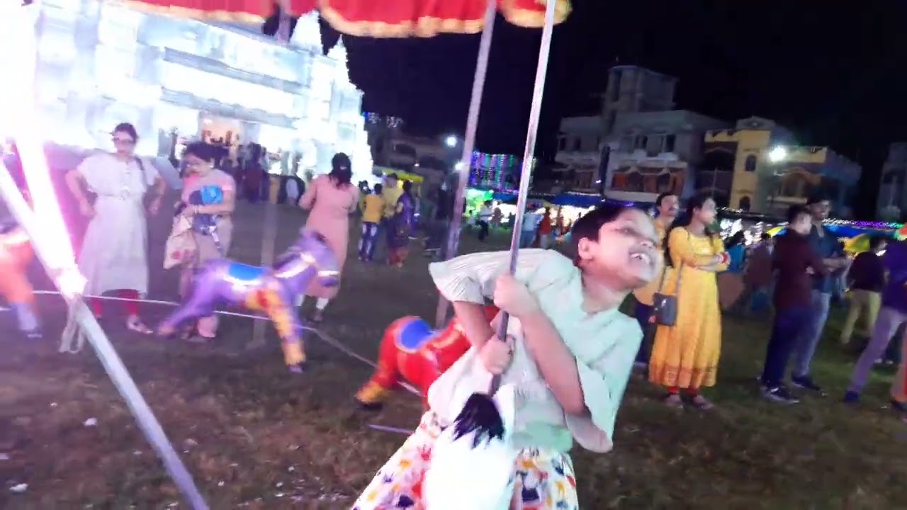 Kausani at nagor dola (merry go round) horse ride Kali Puja mela ...