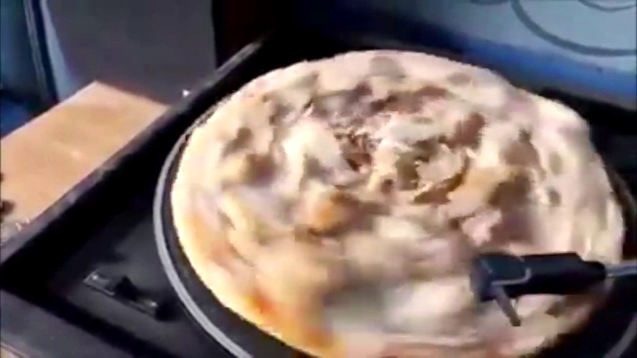 what happens when you put a pizza on a record player - YouTube