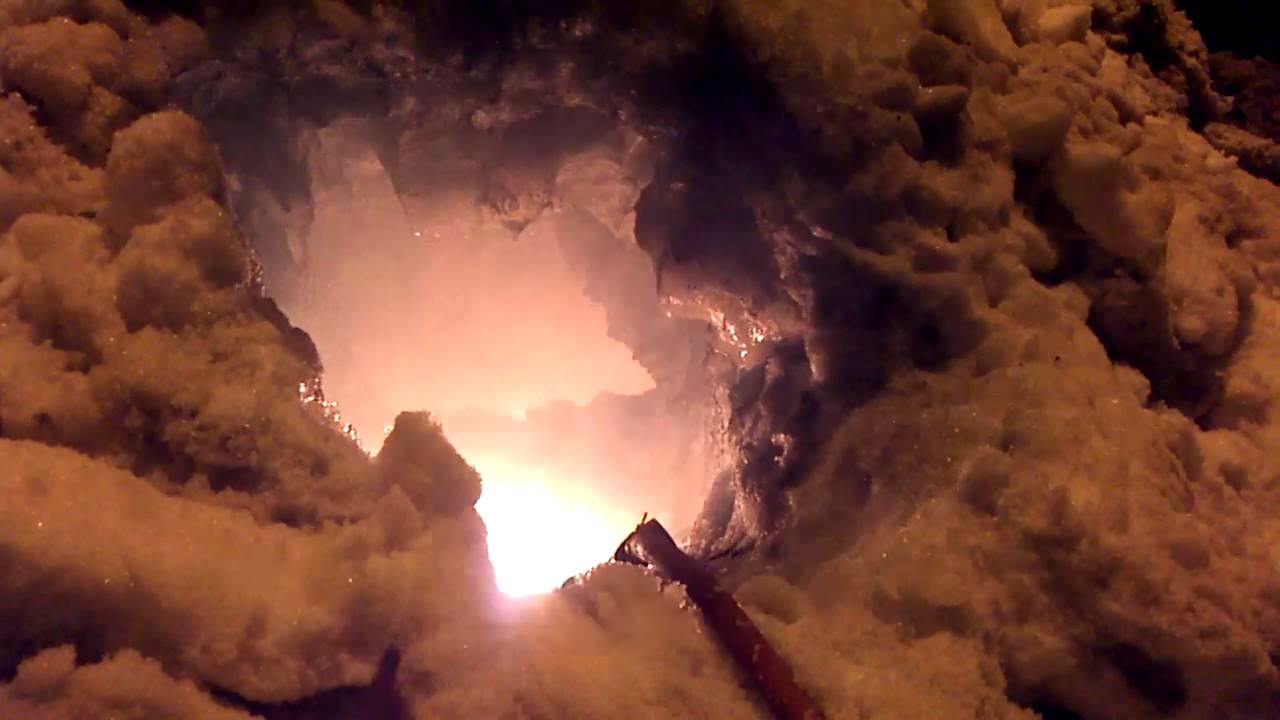 make a fire in a big pile of snow - YouTube